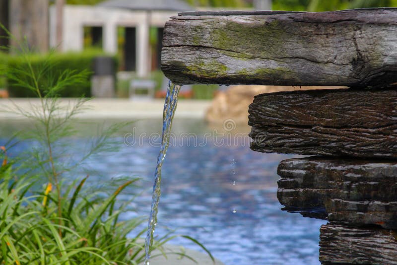 A Stream of Water Flowing into a Swimming Pool Stock Image - Image of ...