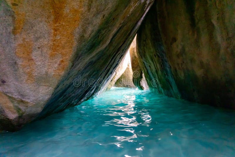 Stream of Water Flowing Under the Rocks Stock Photo - Image of ...