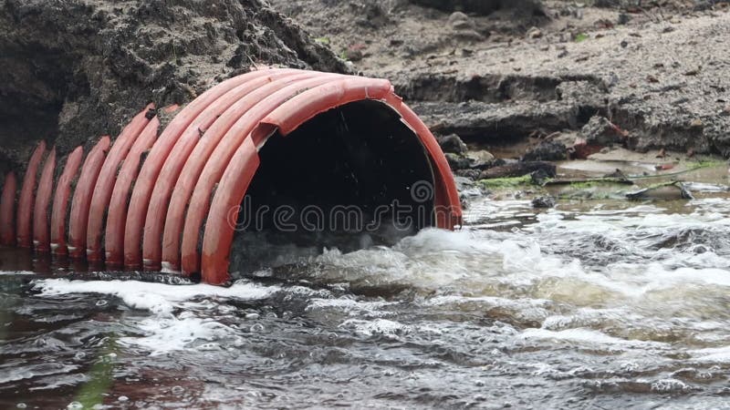 A Stream of Water Flows from a Large Flexible Pipe Stock Video - Video ...
