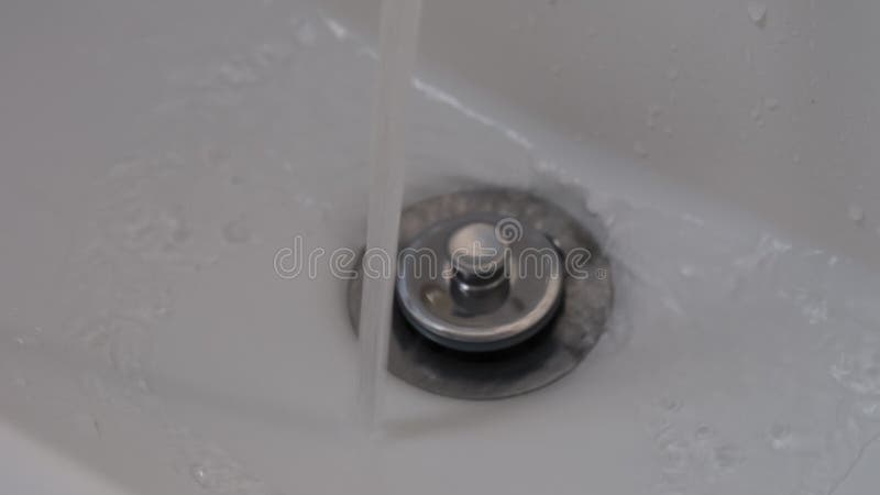 A Stream of Water Going Down a Drain Stock Video - Video of flowing ...