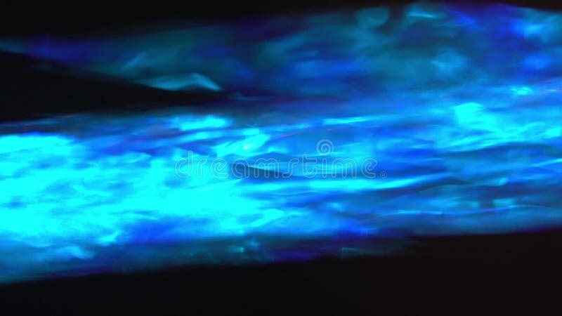 Stream of Water Illuminated by Light Rays of Different Colors Macro ...