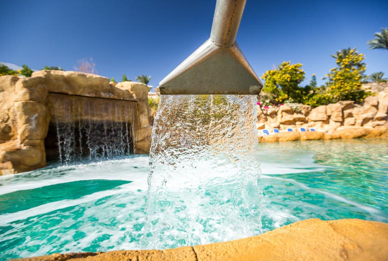 Stream Water Out of Artificial Waterfall in Outdoor Pool Stock Photo ...