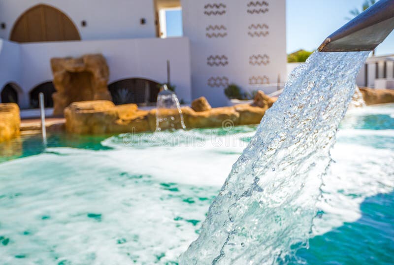 Stream Water Out of Artificial Waterfall in Outdoor Pool Stock Photo ...