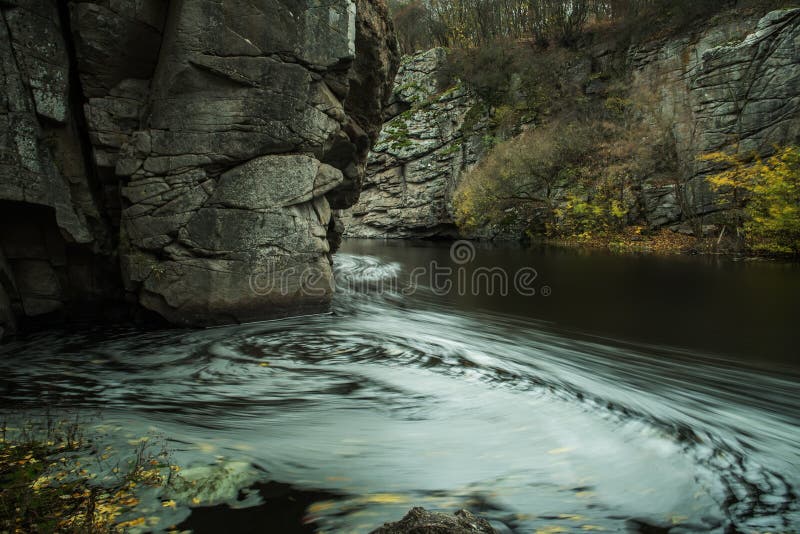 The Stream of Water in the River Flowing between the Rocks Stock Photo ...