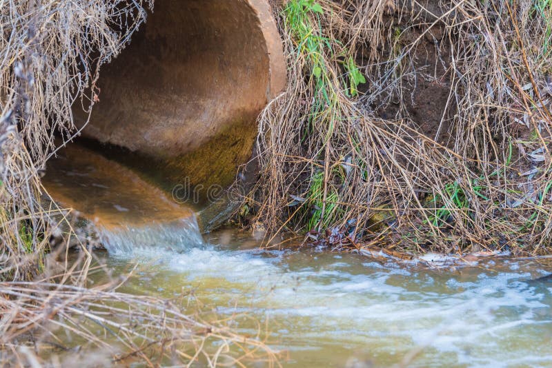 A Stream of Water Running from a Pipe Stock Photo - Image of corrosion ...