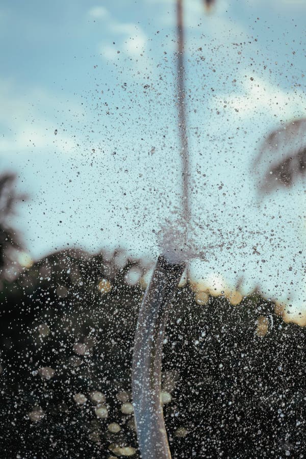 Stream of Water Splashing from a Pipe, Creating a Dramatic Effect with ...