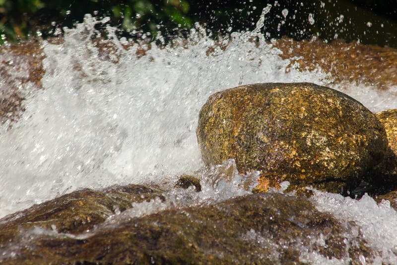 Waterfalls Hit the Rocks Causing Splashes of Water. Stock Image - Image ...