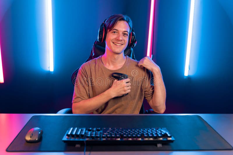 Streamer with Control Joystick Looking at Camera while Playing Game ...