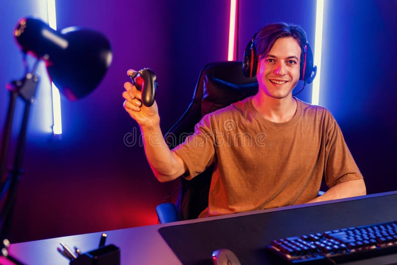 Streamer with Control Joystick Looking at Camera while Playing Game ...