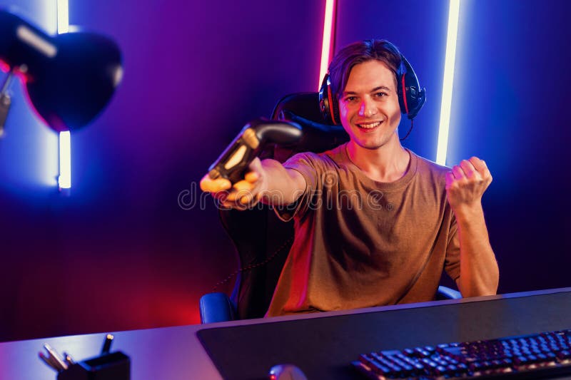 Streamer with Control Joystick Looking at Camera while Playing Game ...