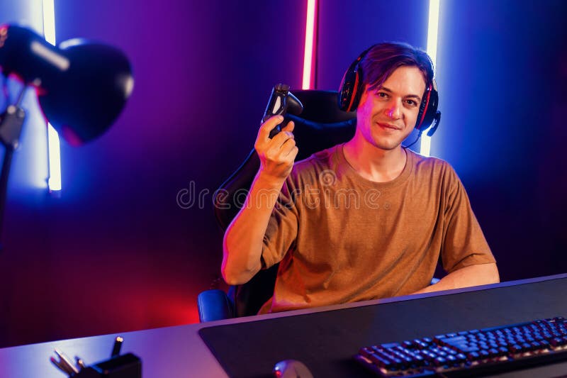 Streamer with Control Joystick Looking at Camera while Playing Game ...