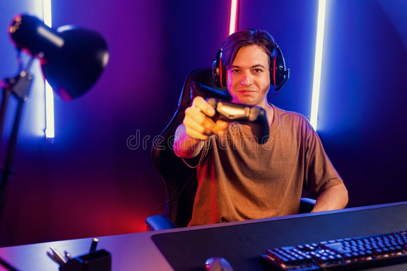 Streamer with Control Joystick Looking at Camera while Playing Game ...