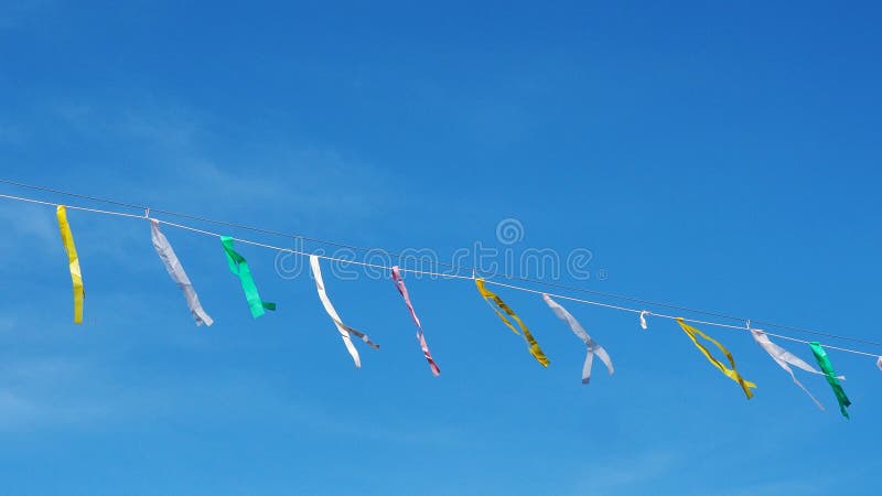 Streamers on a line stock image. Image of yellow, white - 144600817