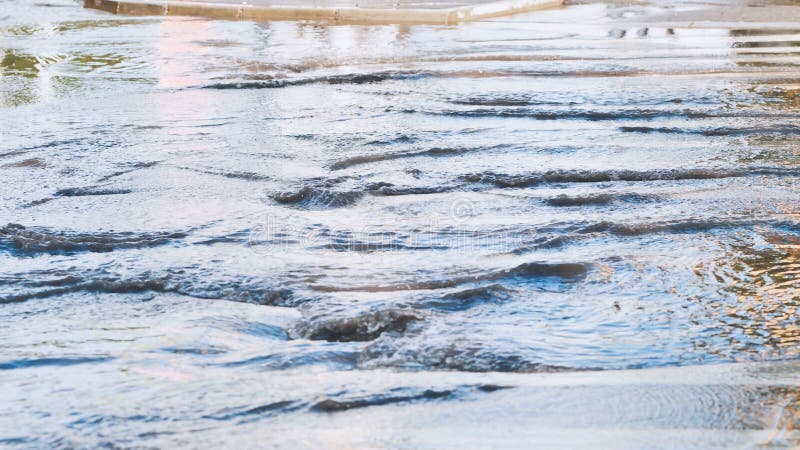 Streams through the Streets of the City after a Heavy Rain. Stock Photo ...