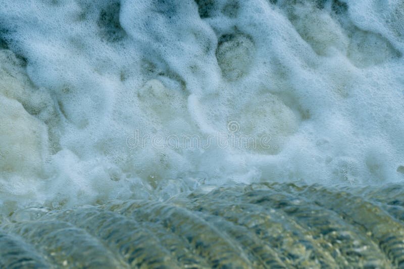 Streams of Water Fall from a Water Dam. Water Foam Stock Photo - Image ...