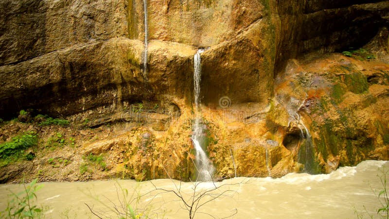 Streams of Water Flow Down from the Mountains into the River. a Small ...