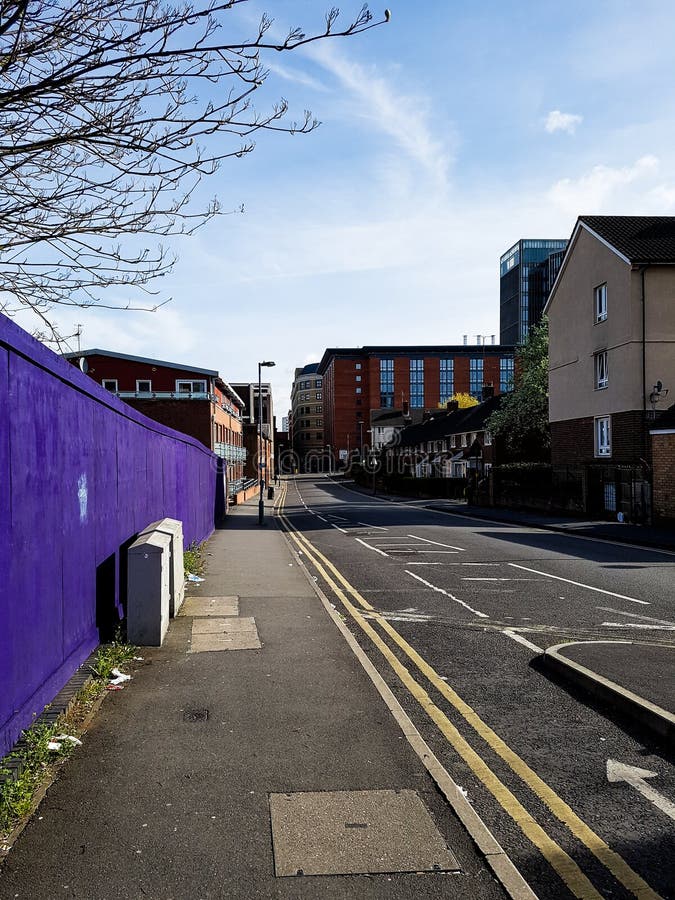 A street with a blue gate stock image. Image of transport - 177320489