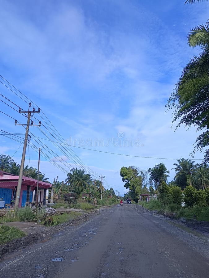 Street with bumpy road stock photo. Image of green, village - 268693068