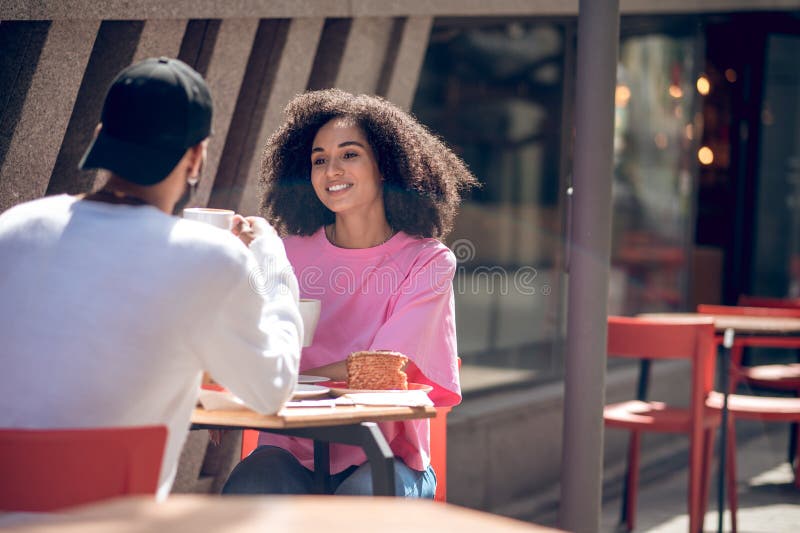 Two Young People Having Coffee at the Street Cafe Stock Image - Image ...