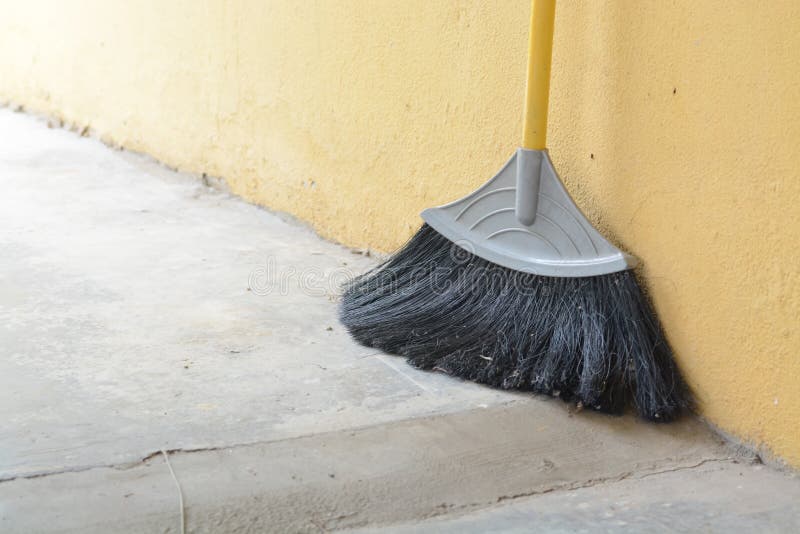 A Street Cleaning Broom is Leaning Against a Concrete Wall Stock Image ...