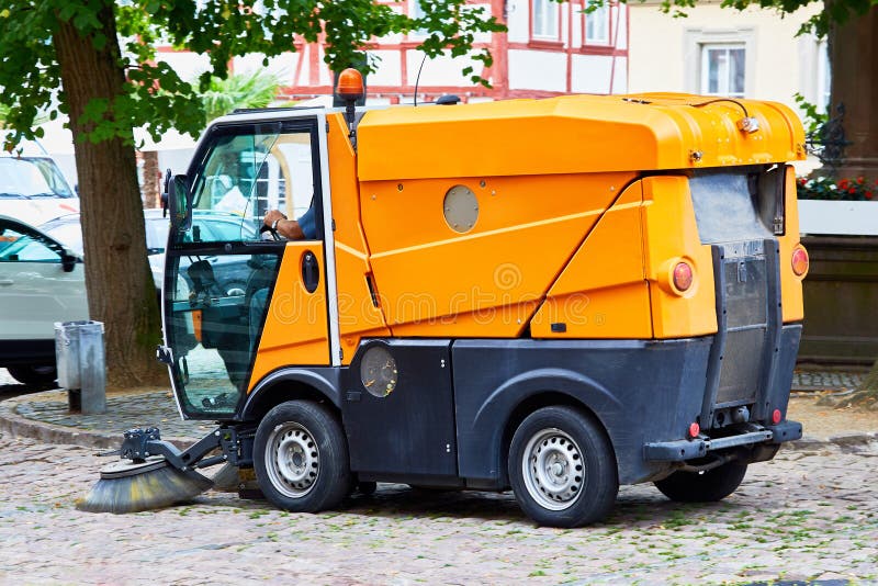 Street Cleaning Machine Sweeping a Cobblestone Road Stock Image - Image ...