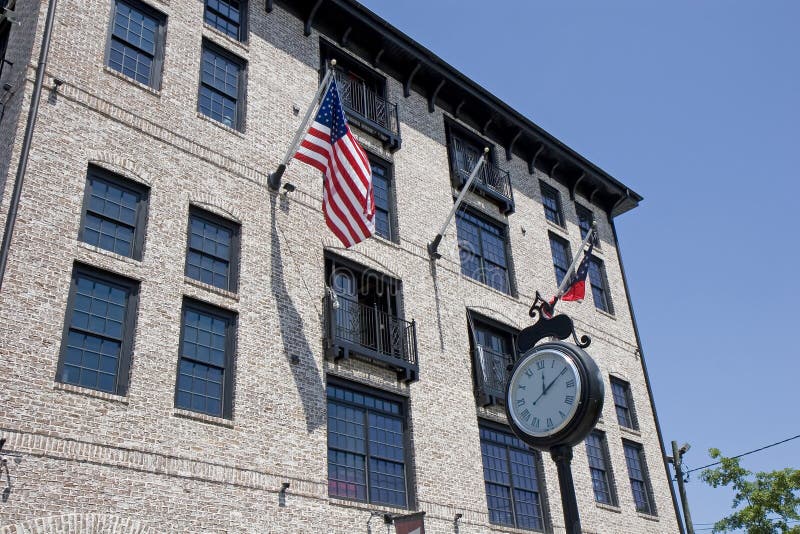 Street Clock and Lofts stock image. Image of purple, buildings - 5611587