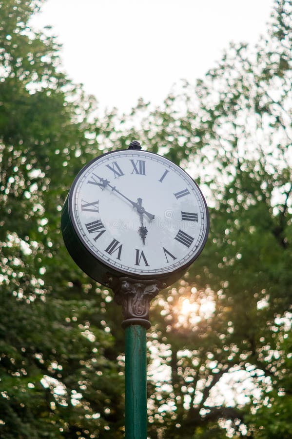 Street clock in the park stock photo. Image of clock - 77139936