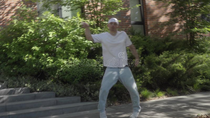 A Street Dancer Performs Dynamic Freestyle, Blending Various Street ...