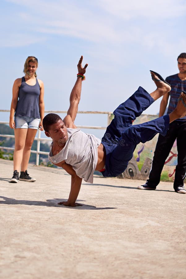 Street Entertainment. a Group of Young People Watching a Breakdancer in ...
