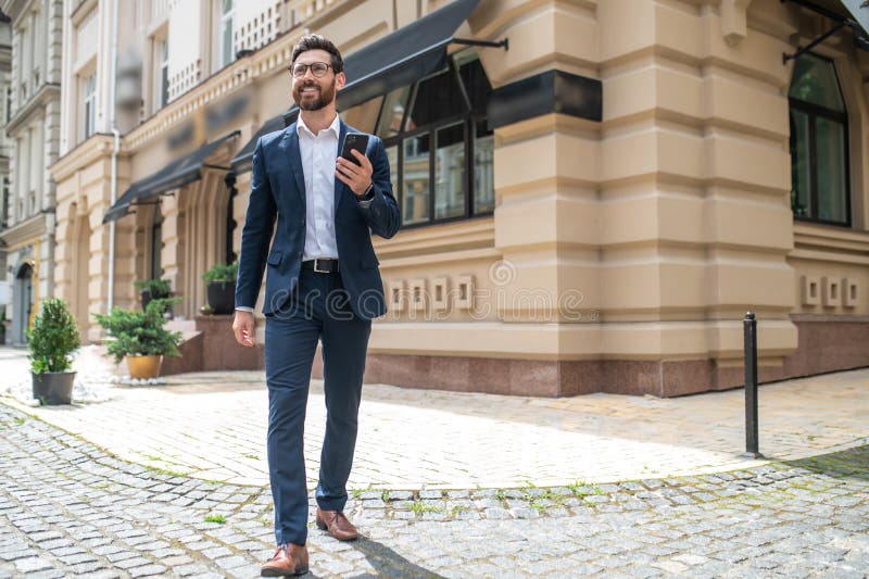 Handsome Young Man in a Suit Walking in the Street Stock Photo - Image ...
