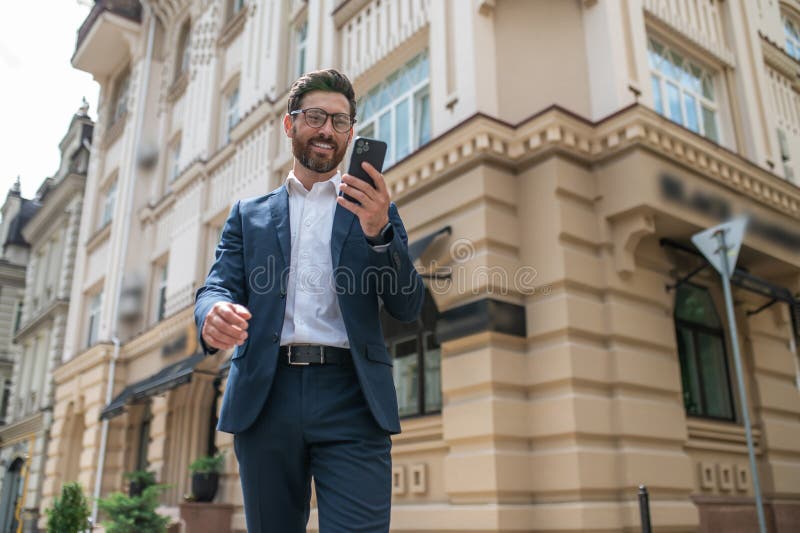 Handsome Young Man in a Suit Walking in the Street Stock Image - Image ... Handsome Young Man in a Suit Walking in the Street Stock Image - Image ...