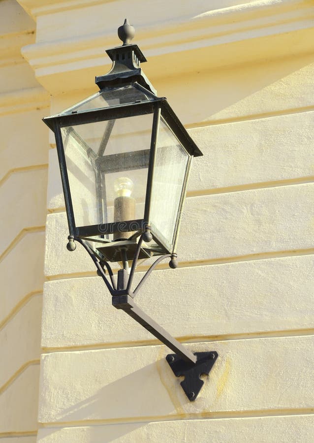 The Street Lamp is Built into the Wall of the Building Stock Photo ...