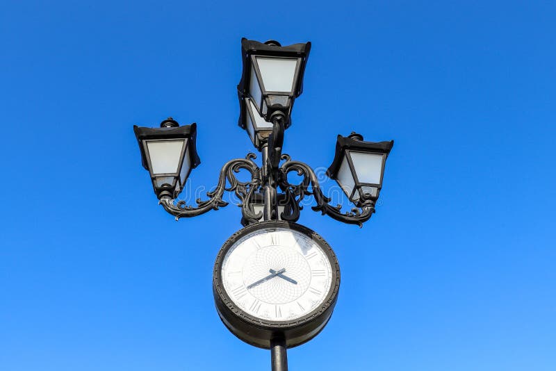 Street lamp with clock stock image. Image of decoration - 237983247