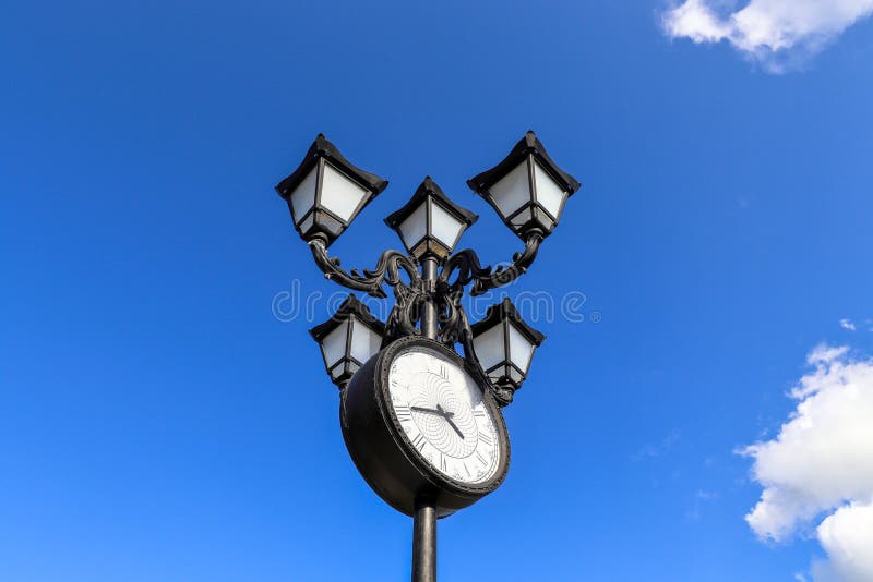 Street lamp with clock stock photo. Image of detail - 237983264