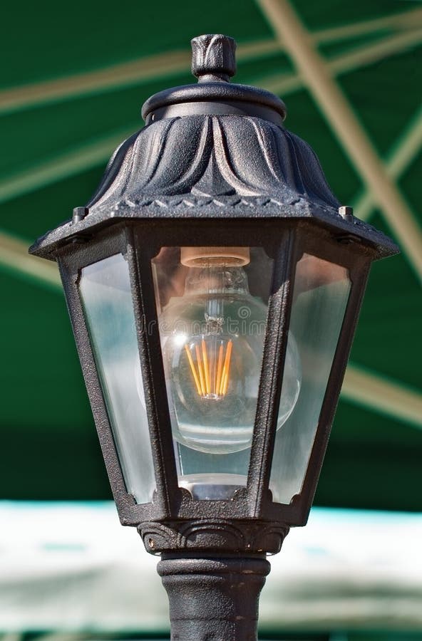 Street Lamp with a Glowing Light Bulb Stock Photo - Image of beautiful ...