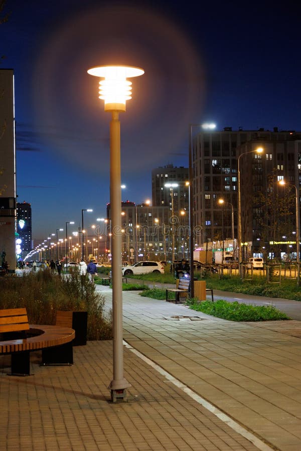 Street Lamp with a Large Yellow Halo Editorial Photo - Image of plaza ...