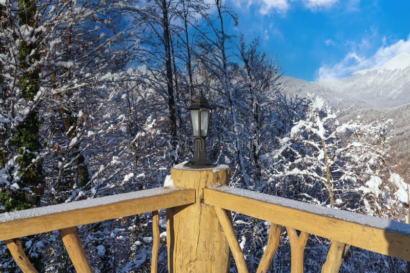Street Lamp in Winter Against Mountains and Trees with Snow Stock Photo ...