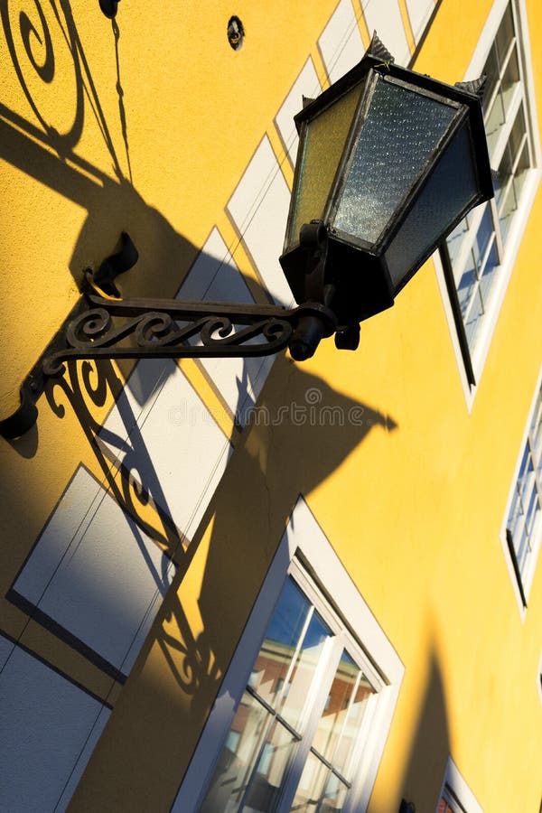 Street Lamp on a Yellow Wall with Windows Stock Photo - Image of baltic ...
