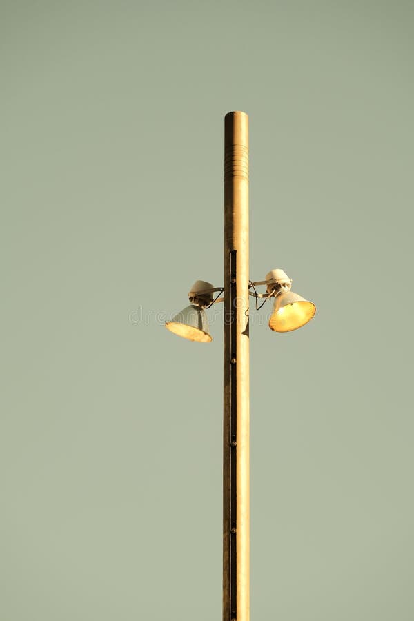 Street Lamps Lit in Broad Daylight with a Blue Sky Stock Photo - Image ...