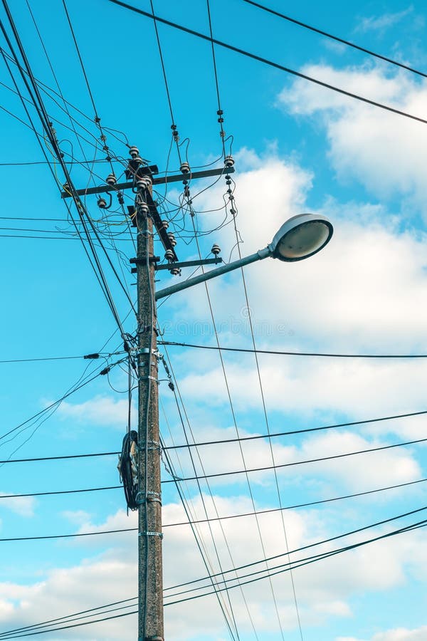 Street Light with Electricity Utility Pole and Messy Electrical Wires ...