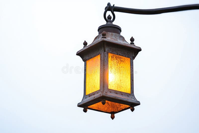 A Street Light Hanging from a Metal Pole on a City Street Stock Image ...