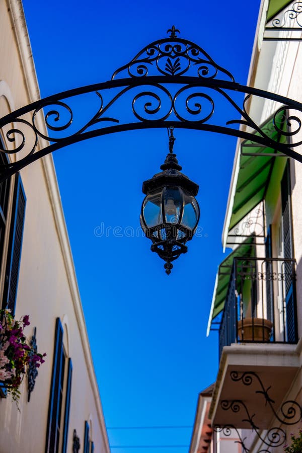 Street Light Hanging Overhead in an Alleyway Stock Photo - Image of ...