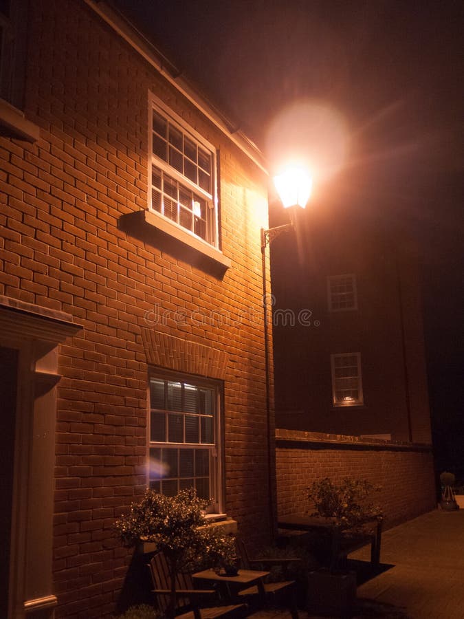 Street Light Outside during the Night Near House Lit Stock Image ...