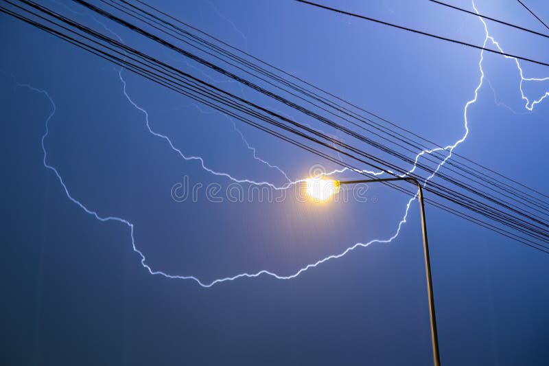 Street Light Pole with Powerful Lighting Bolt and Raining Stock Image ...