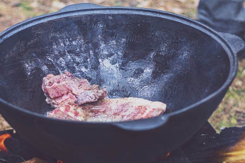 Street Lighting. Fire. a Cooking Pot. Meat is Fried Stock Image - Image ...