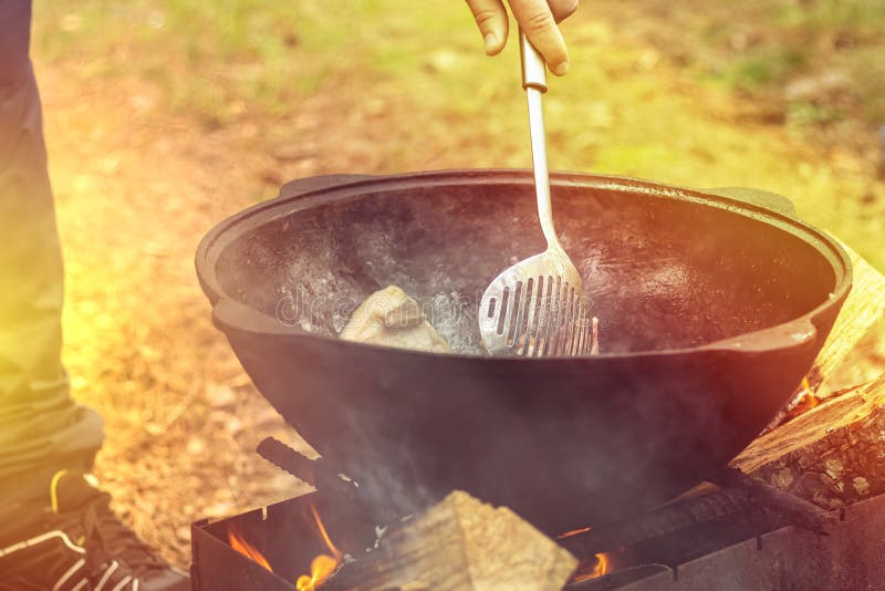 Street Lighting. Fire. a Cooking Pot. Meat is Fried Stock Photo - Image ...