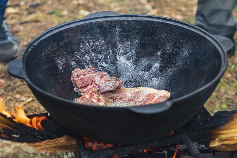 Street Lighting. Fire. a Cooking Pot. Meat is Fried Stock Image - Image ...