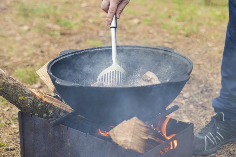 Street Lighting. Fire. a Cooking Pot. Meat is Fried Stock Photo - Image ...