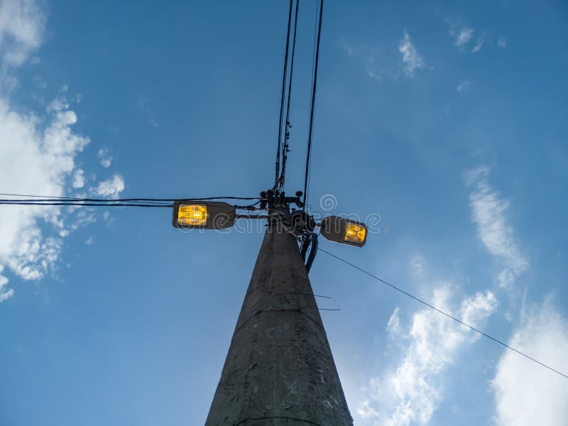 Street Lighting Shines during the Day Stock Photo - Image of city, road ...