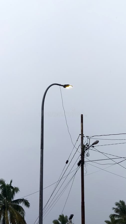 Street Lights, Electricity Poles, Clouds, and Power Lines Stock Photo ...